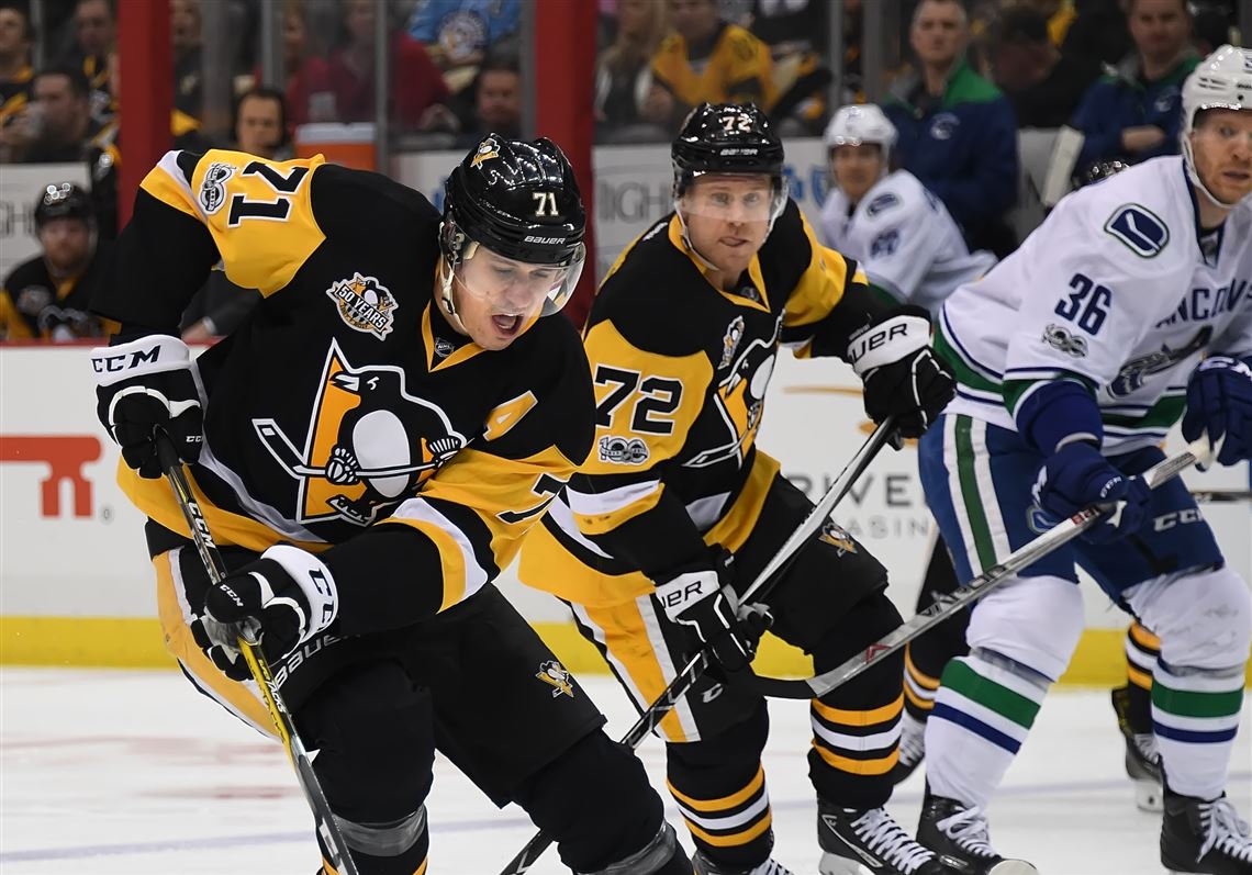 Penguins handle Canucks in 4-0 win; Crosby one point closer to ...