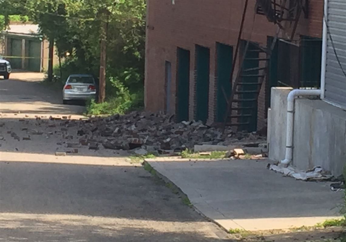 One person injured after bricks fall from Carrick apartment building ...