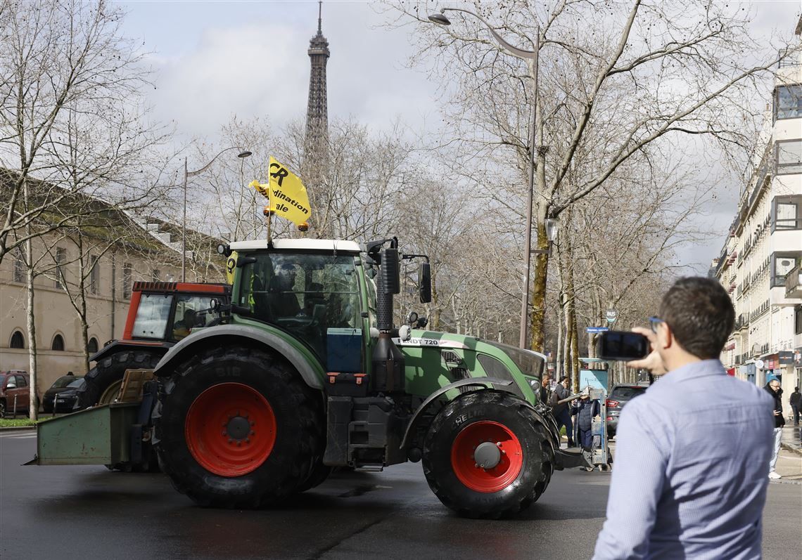 Angry French farmers with tractors are back on the streets of Paris for ...