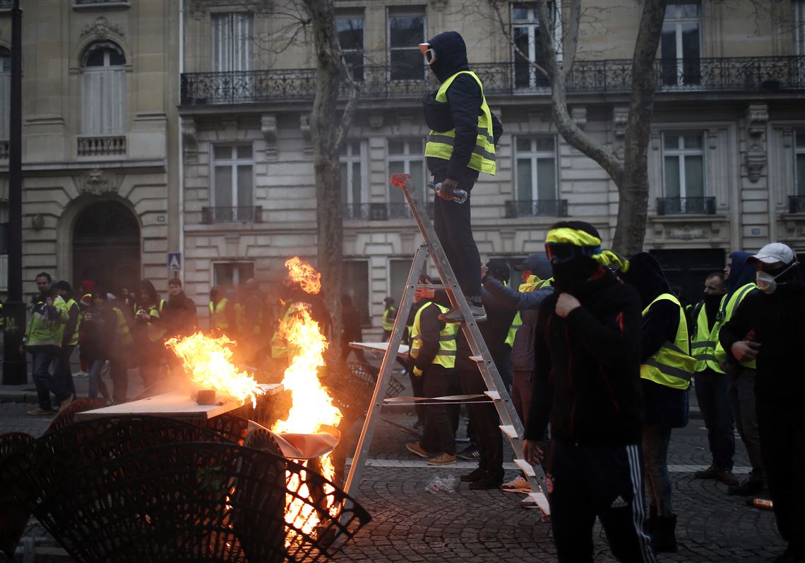 AP FACT CHECK: Trump's trade claims, Paris protesters' chant ...
