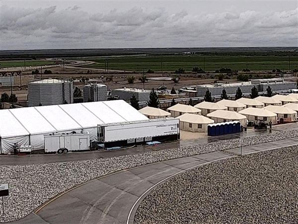 The U.S. waived FBI checks on staff at a growing teen migrant camp in ...